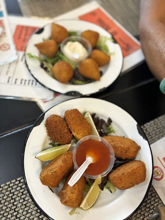 These aren't your average fritters—they're little ambassadors of Brazilian flavor, served with lime wedges and dipping sauce that transform humble cod into something worth crossing town for.