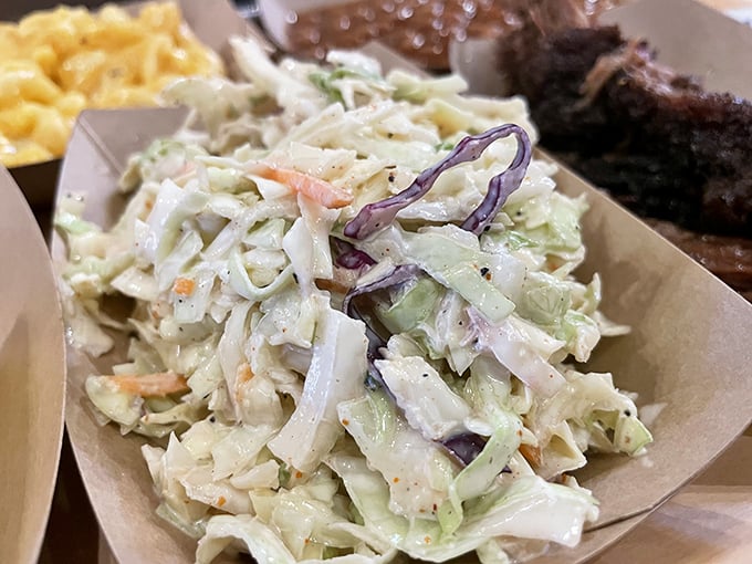Creamy coleslaw that knows its job is to cool down your taste buds between bites of smoky goodness.