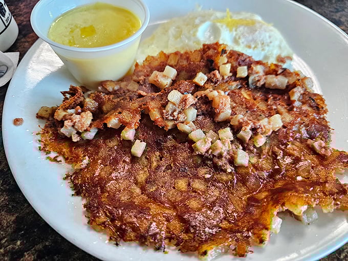 Crispy corned beef hash with perfectly cooked eggs – the breakfast equivalent of finding an extra $20 in your pocket, but infinitely more satisfying.