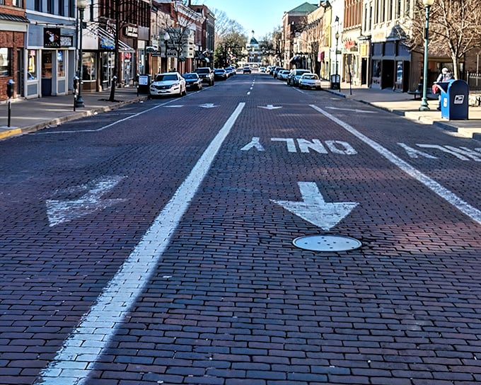 Court Street's brick thoroughfare isn't just a road—it's Athens' red carpet, rolling out a welcome that's been perfected since the 19th century.