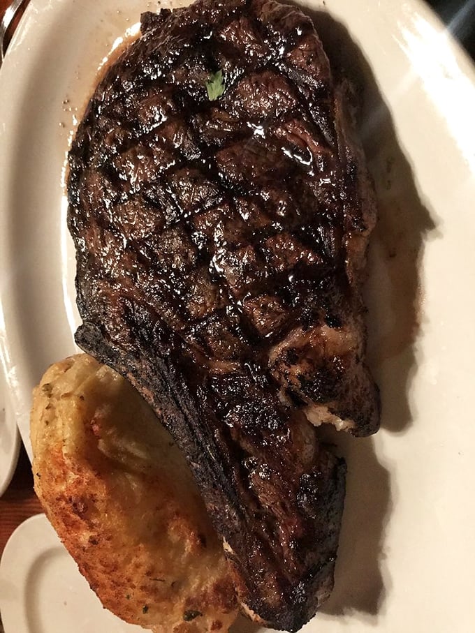 The perfect char marks on this cowboy steak aren't just for show—they're flavor geography, mapping out a journey your taste buds will never forget.