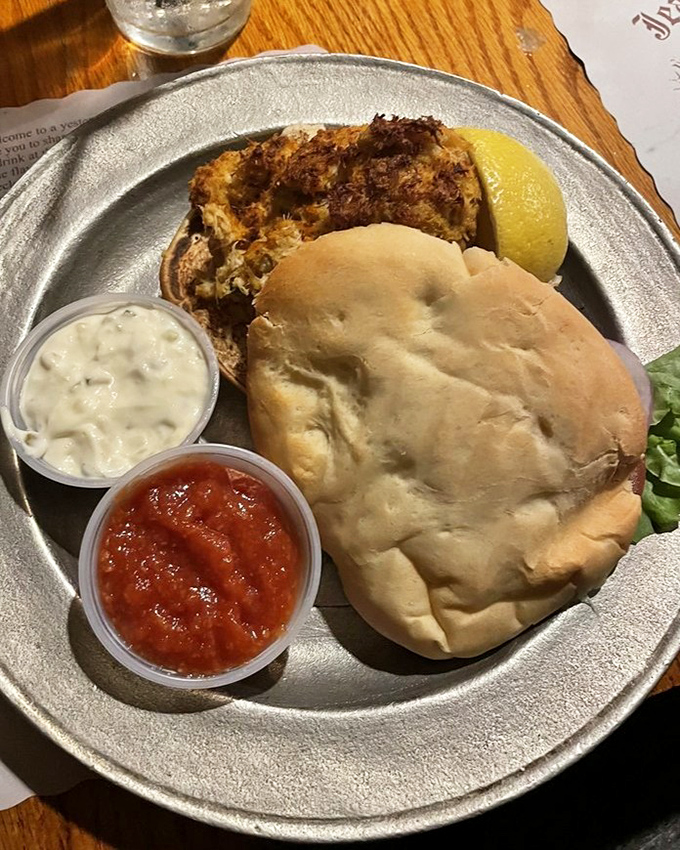 This isn't just a crab cake sandwich—it's maritime treasure on a bun. Accompanied by tangy cocktail sauce and creamy tartar, it's the ocean's finest moment.