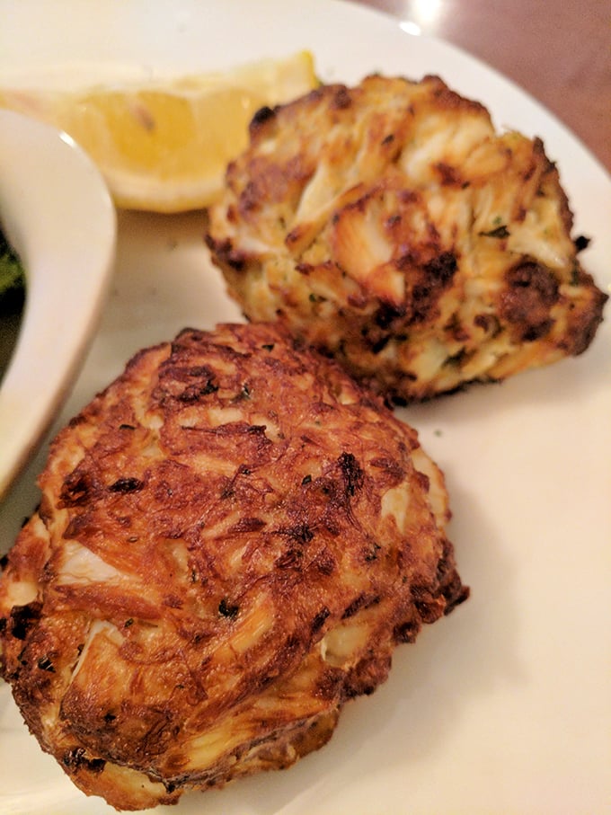 Maryland's culinary crown jewels—crab cakes that are all meat and no filler, a testament to the kitchen's respect for tradition.