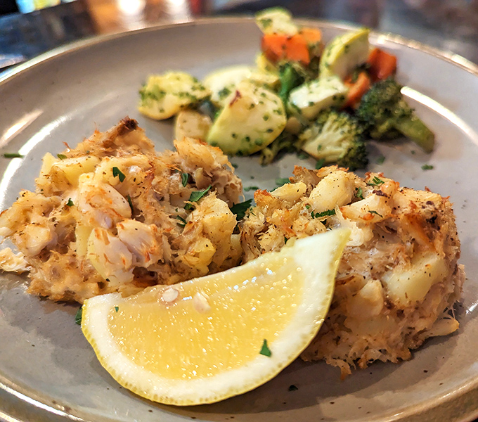 Crab cakes that actually taste like crab—what a concept! These golden-brown beauties deliver the Chesapeake Bay in every succulent bite.