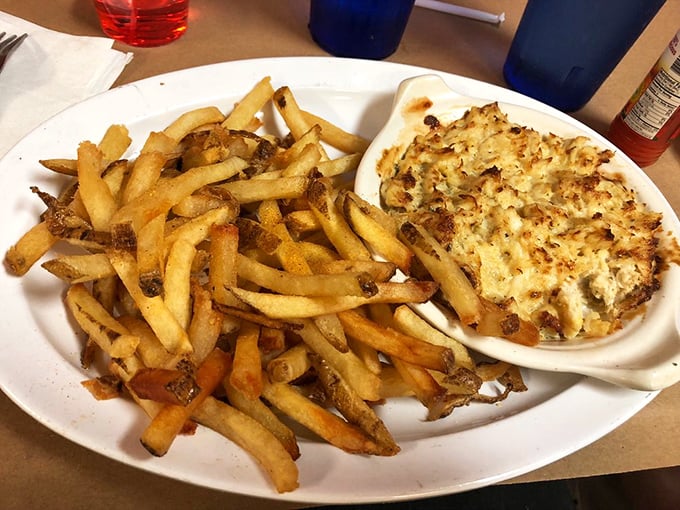 Crab imperial with crispy fries—the dish that makes you wonder why anyone would ever eat anything else in Maryland.