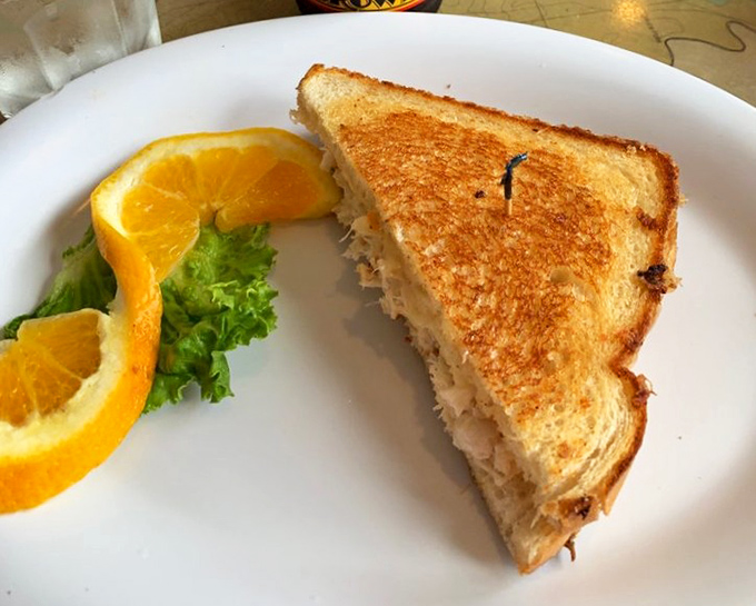 This isn't just a sandwich; it's edible architecture – perfectly toasted bread housing what might be the Bay Area's most honest crab filling.
