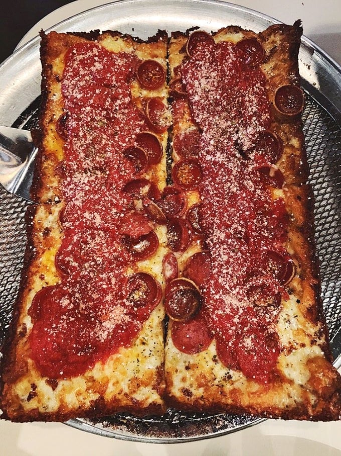 Detroit-style pizza that would make Motor City proud—those caramelized cheese edges are the culinary equivalent of finding an extra $20 in your pocket.