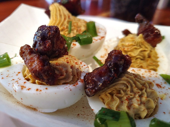 These aren't your aunt's potluck deviled eggs. The jalapeño bacon crown transforms this humble appetizer into royalty.