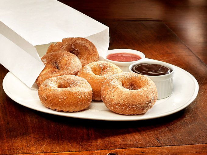 Sugar-dusted donuts with dipping sauces—because sometimes dessert should be interactive and remind you of your childhood, just with better execution.