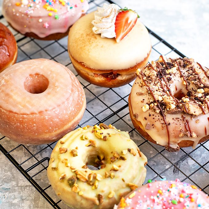Donut decision paralysis is real—glazed, sprinkled, or topped with nuts, each ring of joy promises a moment of sweet escape from everyday worries.