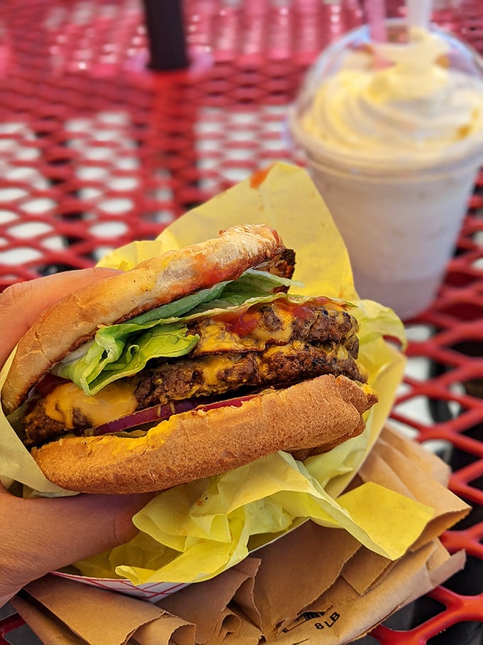 The double ranch burger isn't just a meal—it's a structurally impressive achievement of beef architecture that requires both hands and total commitment.