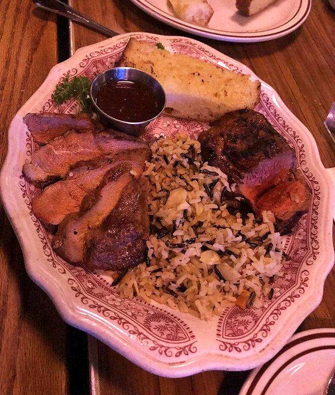 A plate that answers the eternal question: "Why choose between duck and steak when you can have both?" Wild rice that's actually exciting – not an oxymoron here.