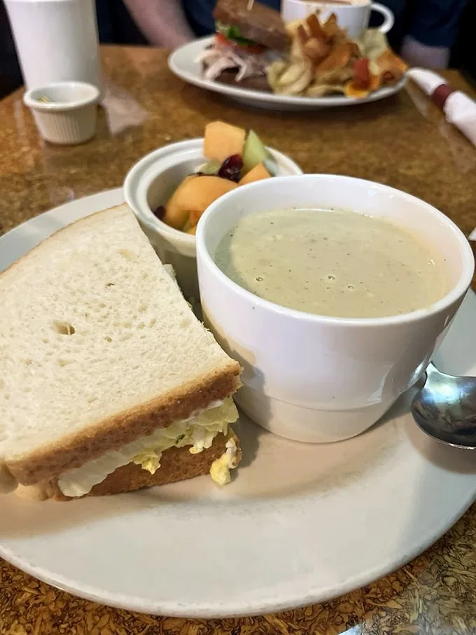 The humble egg salad sandwich gets its moment in the spotlight, while a cup of bisque stands by like a loyal sidekick ready for its dip-worthy moment.