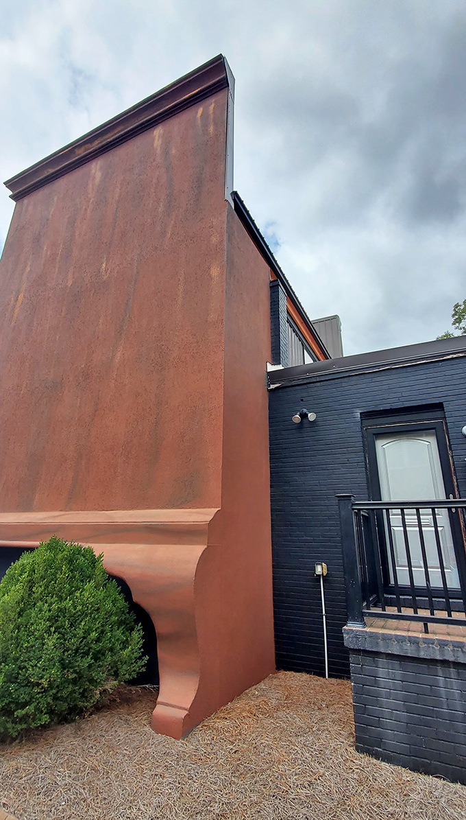 The side view reveals just how massive this landmark truly is—like standing next to the Empire State Building of bedroom furniture.