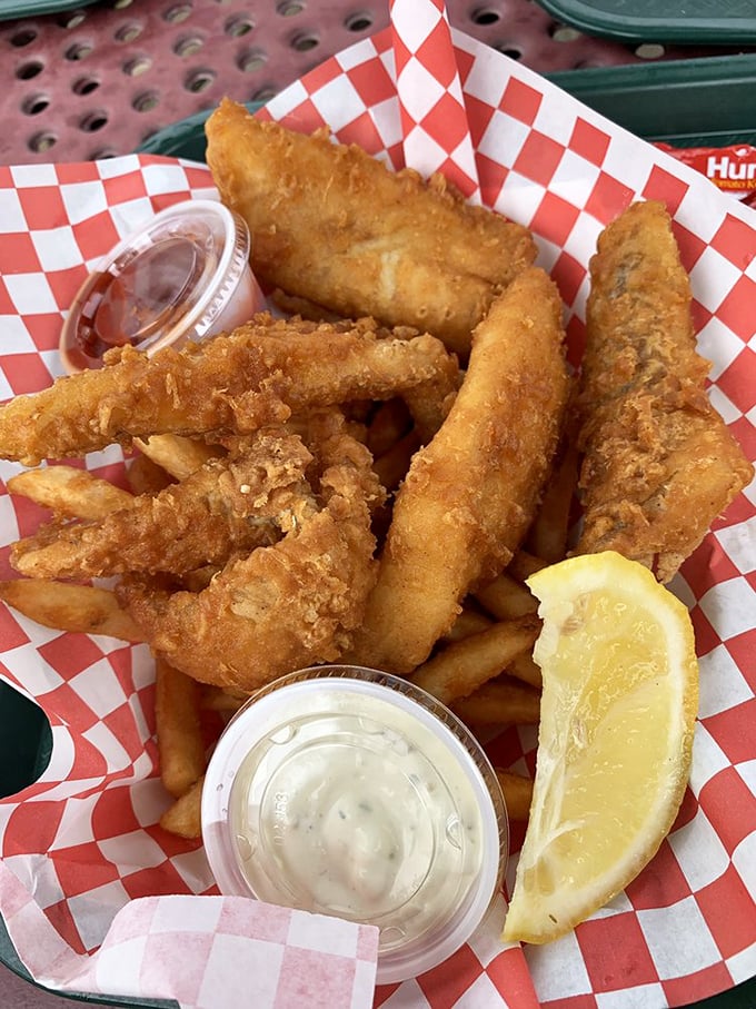 These golden fish fillets aren't just fried—they're transformed into crispy vessels of oceanic delight, with fries standing by for the perfect supporting role.