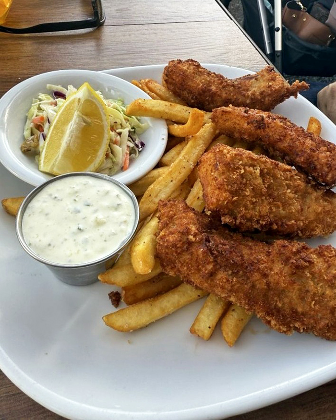 Golden fish and chips so perfectly executed, they'd make a British pub owner weep tears of pure joy. 