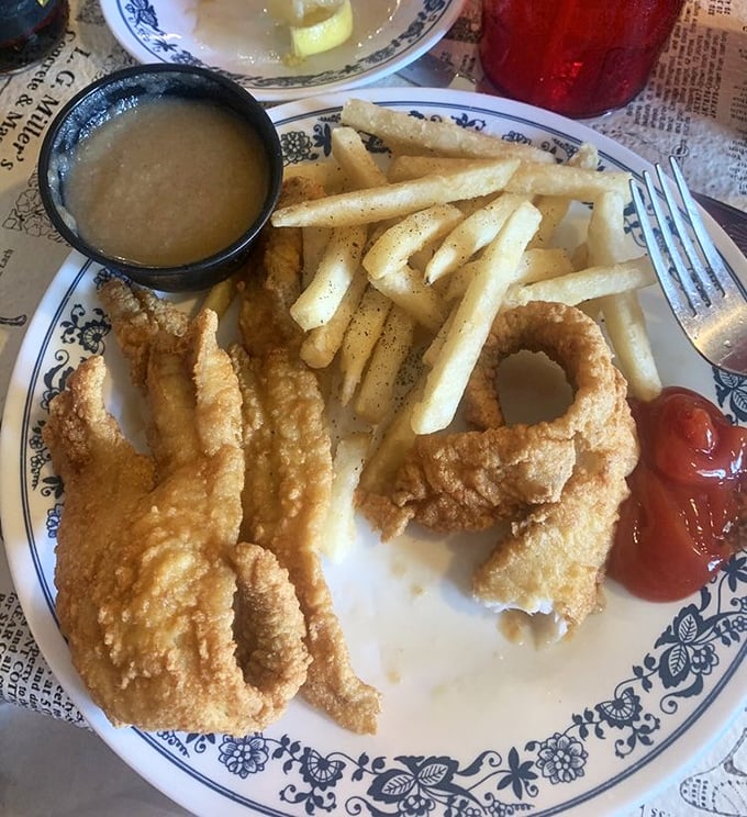 Golden-battered fish that shatters with each bite, alongside perfectly crisp fries. The small cup of gravy says, "I'm not just any roadside diner."