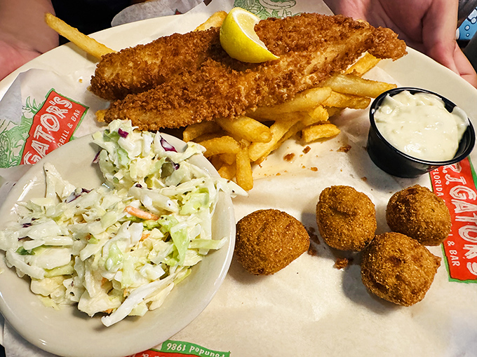 The ultimate Florida trifecta: perfectly breaded fish, crispy hushpuppies, and fresh coleslaw. Seafood this good doesn't need a sunset view—though it wouldn't hurt.