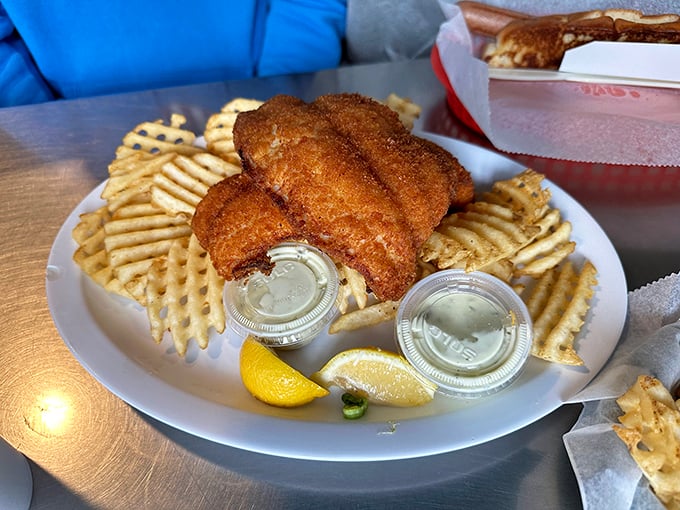 Golden-brown perfection meets waffle fries in a dish that would make Captain Ahab forget all about that whale.