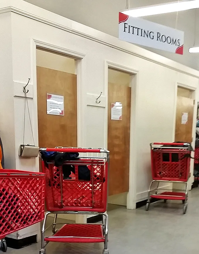 The fitting room corridor—where thrift store dreams either come true or get returned to the rack. Always bring a friend for honest opinions!