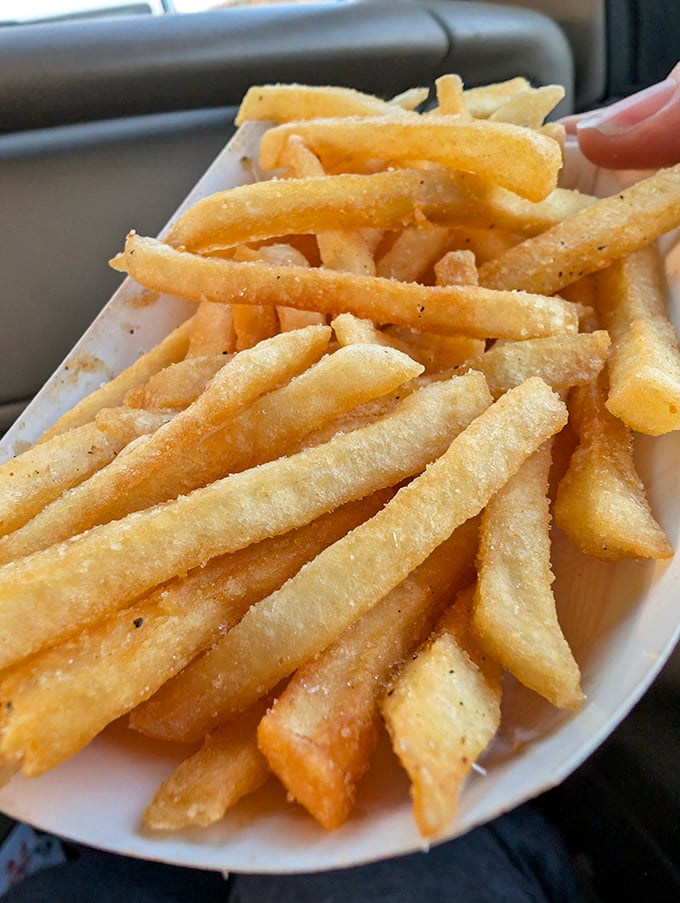 Golden, crispy, and perfectly salted—these fries aren't trying to reinvent the wheel, they're just mastering it one batch at a time.