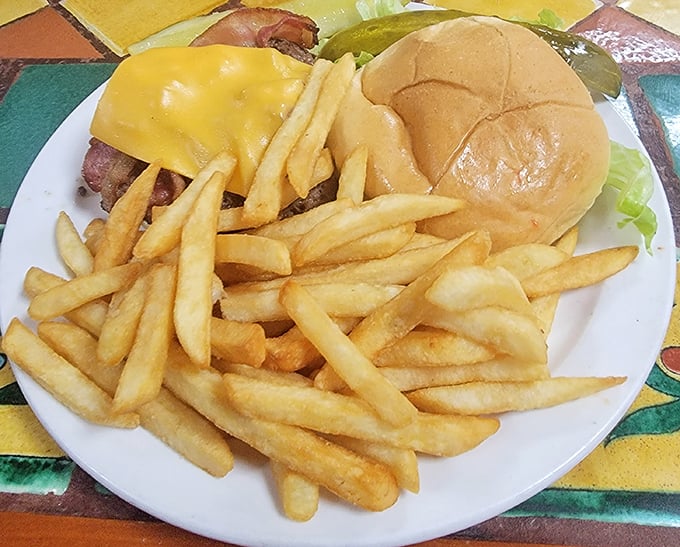 These aren't just fries—they're golden happiness sticks, perfectly crisp companions to a burger that means business.