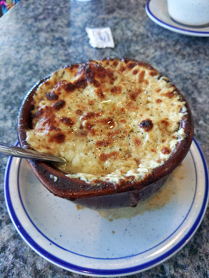 French onion soup with a cheese cap so perfectly browned it deserves its own trophy. Comfort in a crock.