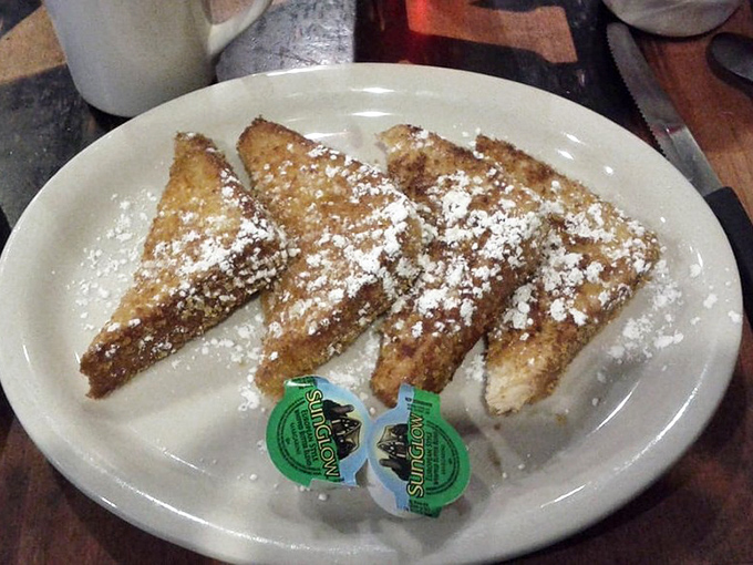 French toast dusted with powdered sugar—simple, classic, and arranged with the kind of precision that suggests they know exactly what they're doing.