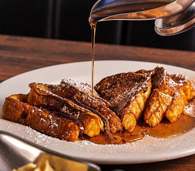 French toast getting the maple syrup waterfall treatment – a breakfast moment so perfect it deserves its own slow-motion sequence. 
