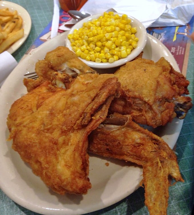 Fried chicken so perfectly golden it deserves its own Instagram account. That audible crunch is the sound of your diet plan waving goodbye.