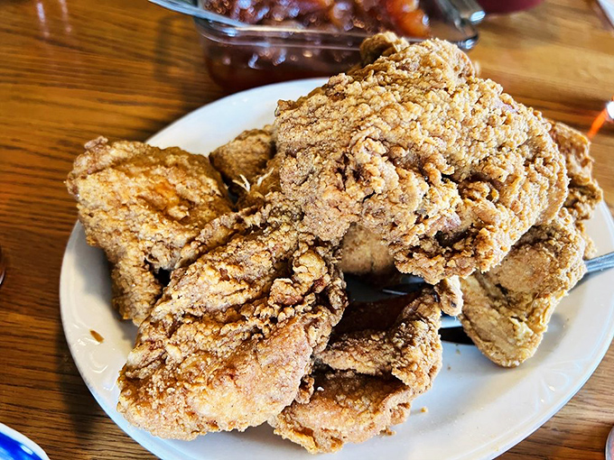 Fried chicken so perfectly golden it should have its own Instagram account. The crunch is audible three tables away.