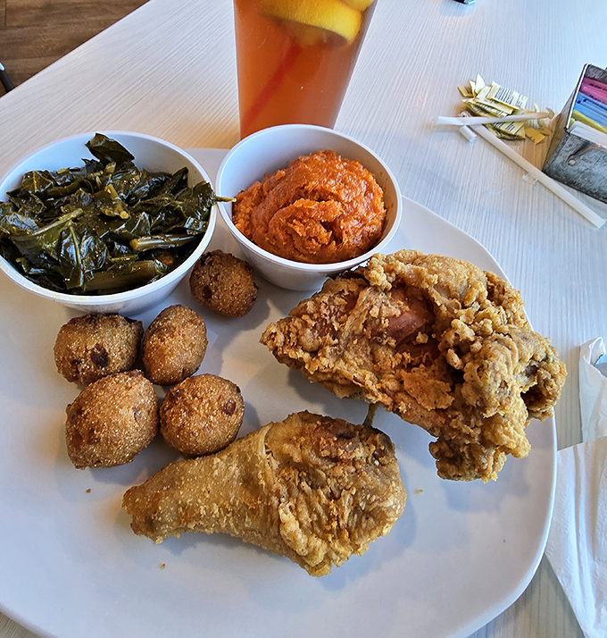 Southern fried chicken, hush puppies, and collard greens—the holy trinity of comfort food. Calories worth every delicious minute on the treadmill tomorrow.