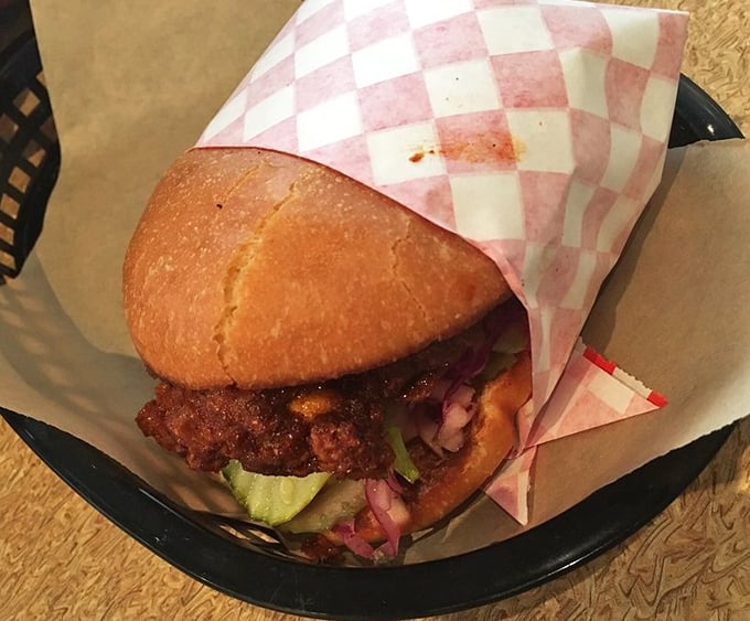 The perfect fried chicken sandwich doesn't exi— Oh wait, here it is, peeking out from checkered paper like it knows exactly how good-looking it is.