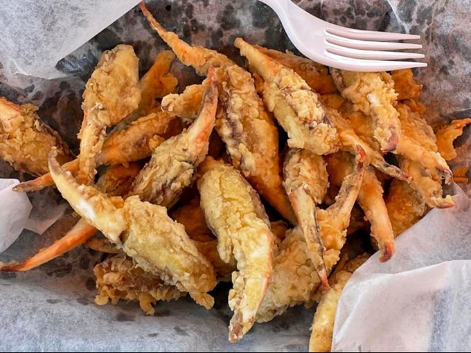The stars of the show – golden-fried crab claws that snap with sweetness and make you wonder why you'd ever waste time on anything else.