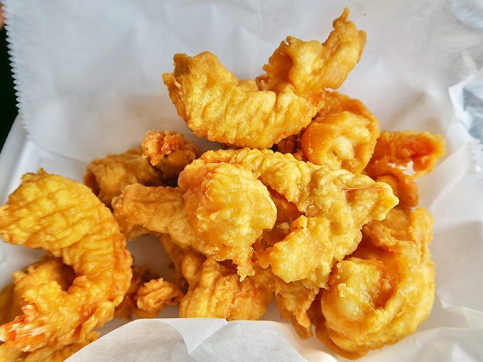Golden treasures from the fryer. These aren't just any fried shrimp – they're the reason locals whisper Nunn's name with reverence.