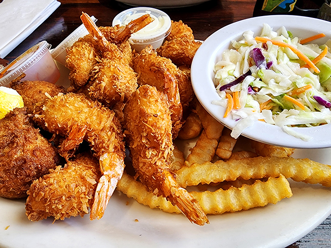 Coconut shrimp that could make a pescatarian weep with joy. Crispy, golden coating giving way to perfectly cooked shrimp—seafood alchemy at its finest.