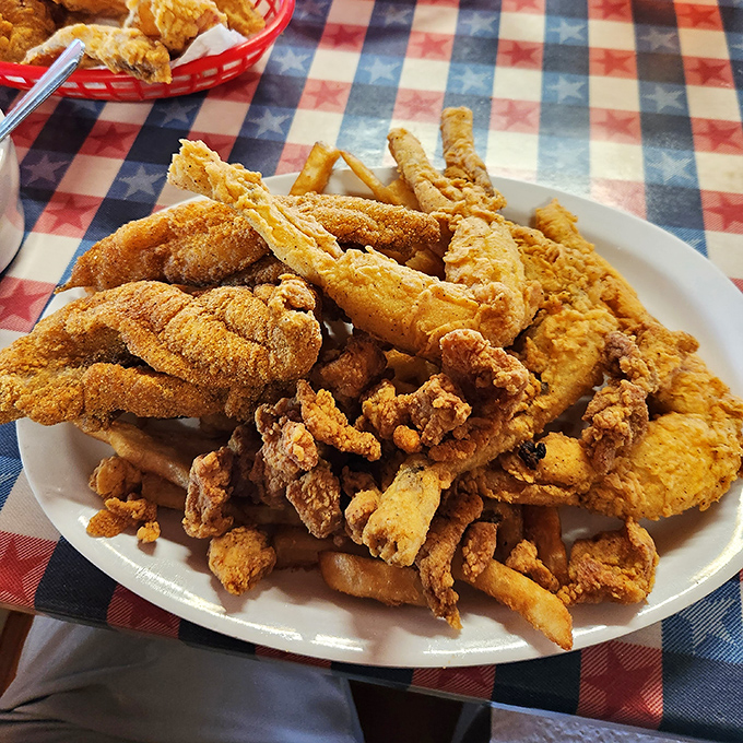 A mountain of golden-fried goodness that could convert even the most dedicated food snob. This platter isn't just a meal—it's a celebration of Southern frying techniques.