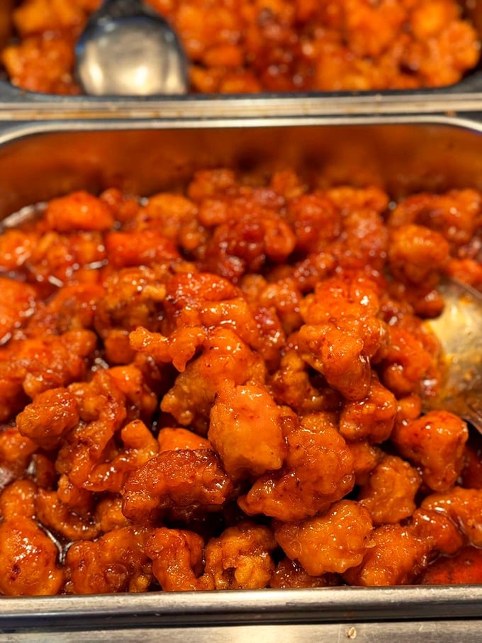 General Tso's chicken glistening with that perfect sweet-spicy glaze—the dish that's launched a thousand "just one more plate" promises.