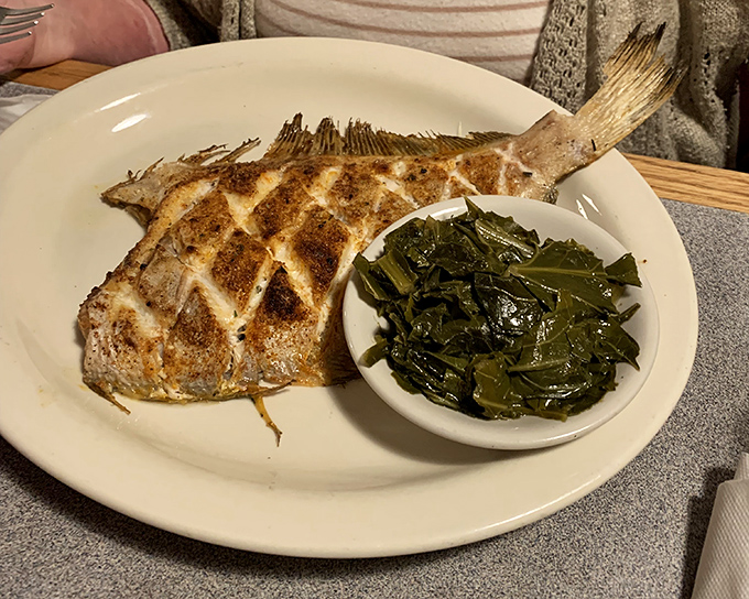 This grilled flounder with collard greens isn't just dinner—it's Southern poetry on a plate. The fish looks like it's still dreaming of the ocean.