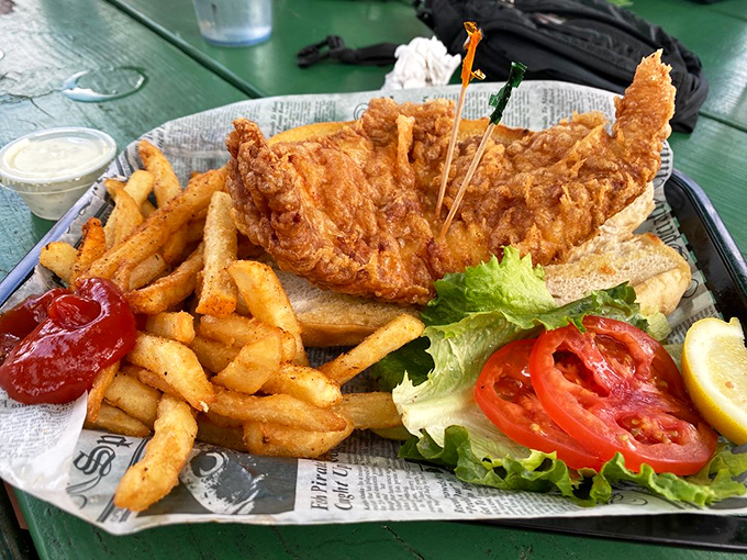 This isn't just a grouper sandwich—it's Florida's maritime heritage served between two pieces of bread with a side of crispy fries.