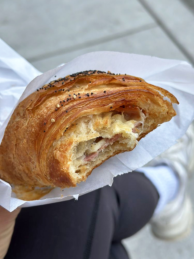 The ham and cheese croissant reveals itself like a buttery archaeological dig—each layer flakier and more revelatory than the last.