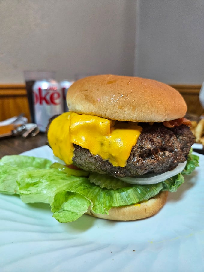 A burger that means business. That melted cheese cascading down the sides isn't just decoration—it's a promise of deliciousness.