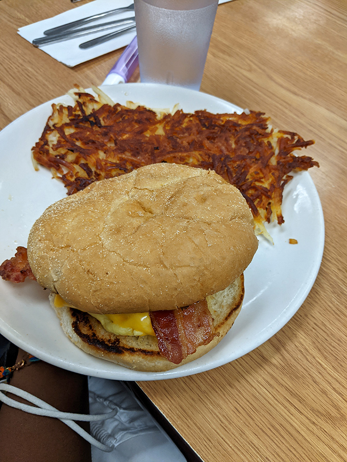 This isn't just a burger and hash browns—it's edible architecture where the crispy potato foundation deserves its own standing ovation.