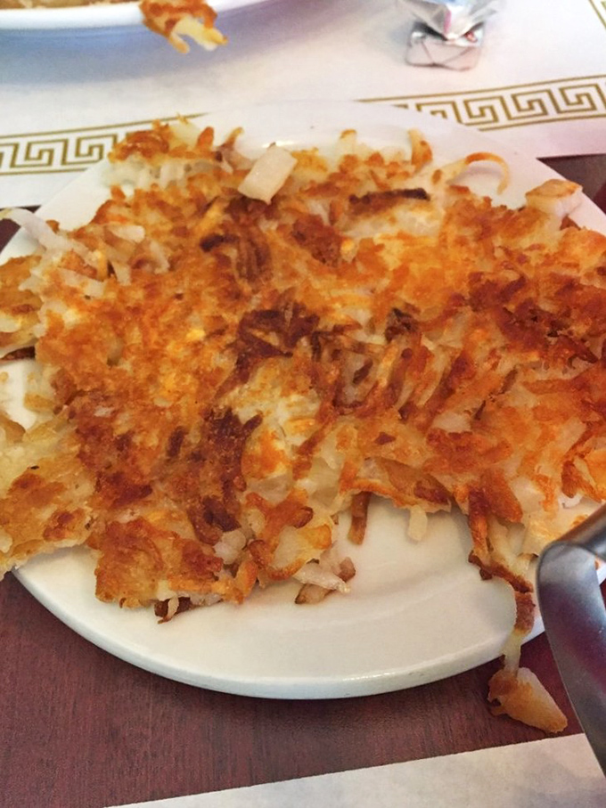 Hash browns achieving that mythical balance—golden-crisp exterior giving way to tender potato within. The breakfast equivalent of striking gold in the Old West.