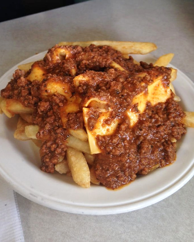 These aren't just home fries—they're a meaty masterpiece. Crispy potatoes smothered in savory ground beef sauce create the comfort food equivalent of a warm hug.