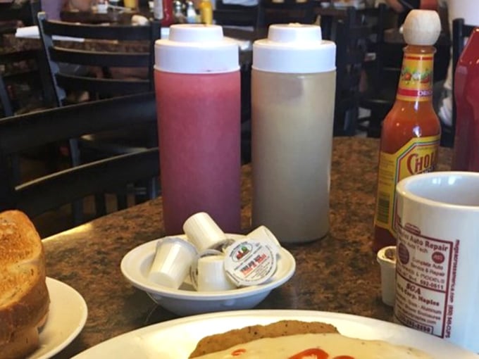 Those squeeze bottles aren't just condiment containers—they're flavor delivery systems, standing ready like breakfast superheroes waiting to be summoned.
