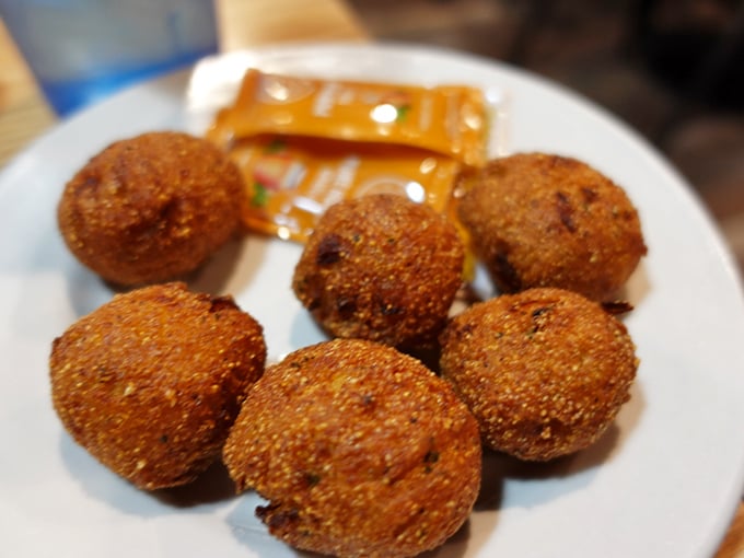 These golden hush puppies aren't just side dishes—they're little spheres of cornmeal perfection that deserve their own standing ovation and Instagram account.