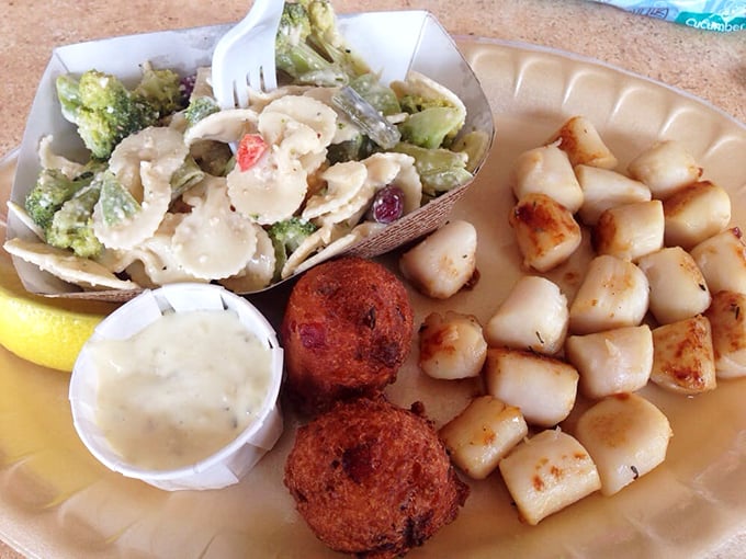 Comfort food, Florida-style. Golden hush puppies and perfectly seared scallops prove that sometimes the simplest pleasures make the most memorable meals.