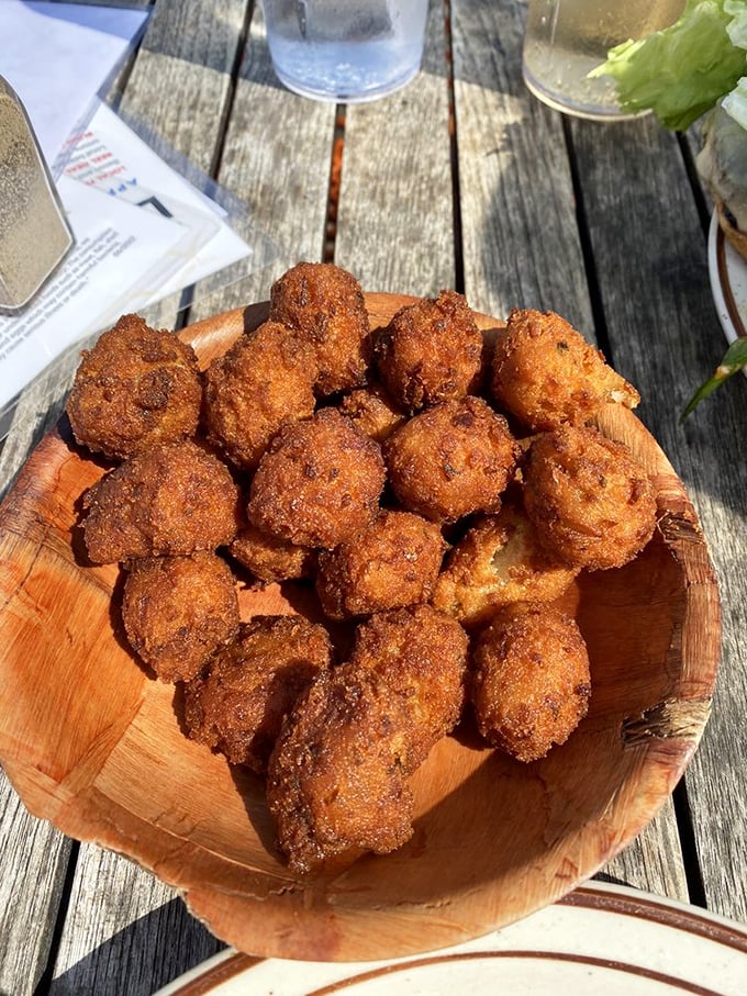 These hush puppies aren't just golden brown—they're little cornmeal meteors of joy that might cause involuntary happy noises.