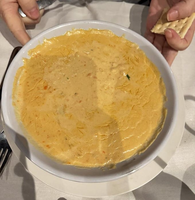 This lobster bisque isn't just soup—it's liquid gold. Creamy, rich, and demanding to be scooped up with those crackers.